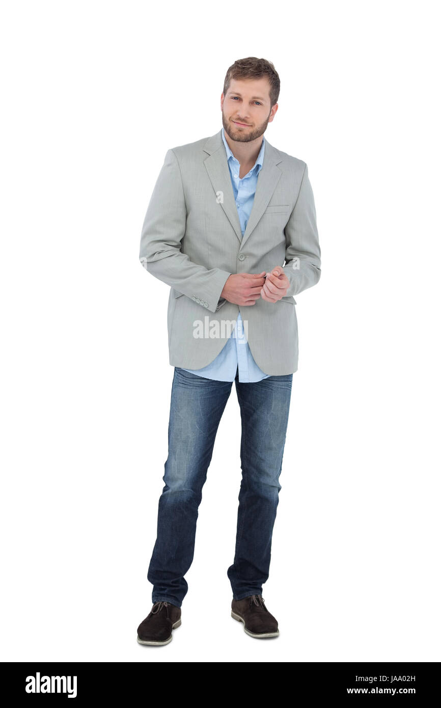 Suave man in a blazer posing on white background Stock Photo - Alamy