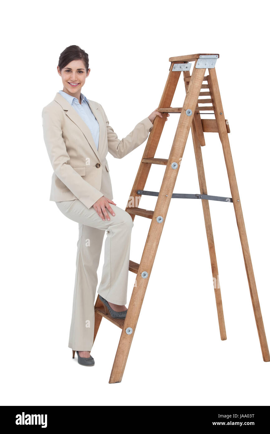 Happy businesswoman climbing the career ladder on white background ...