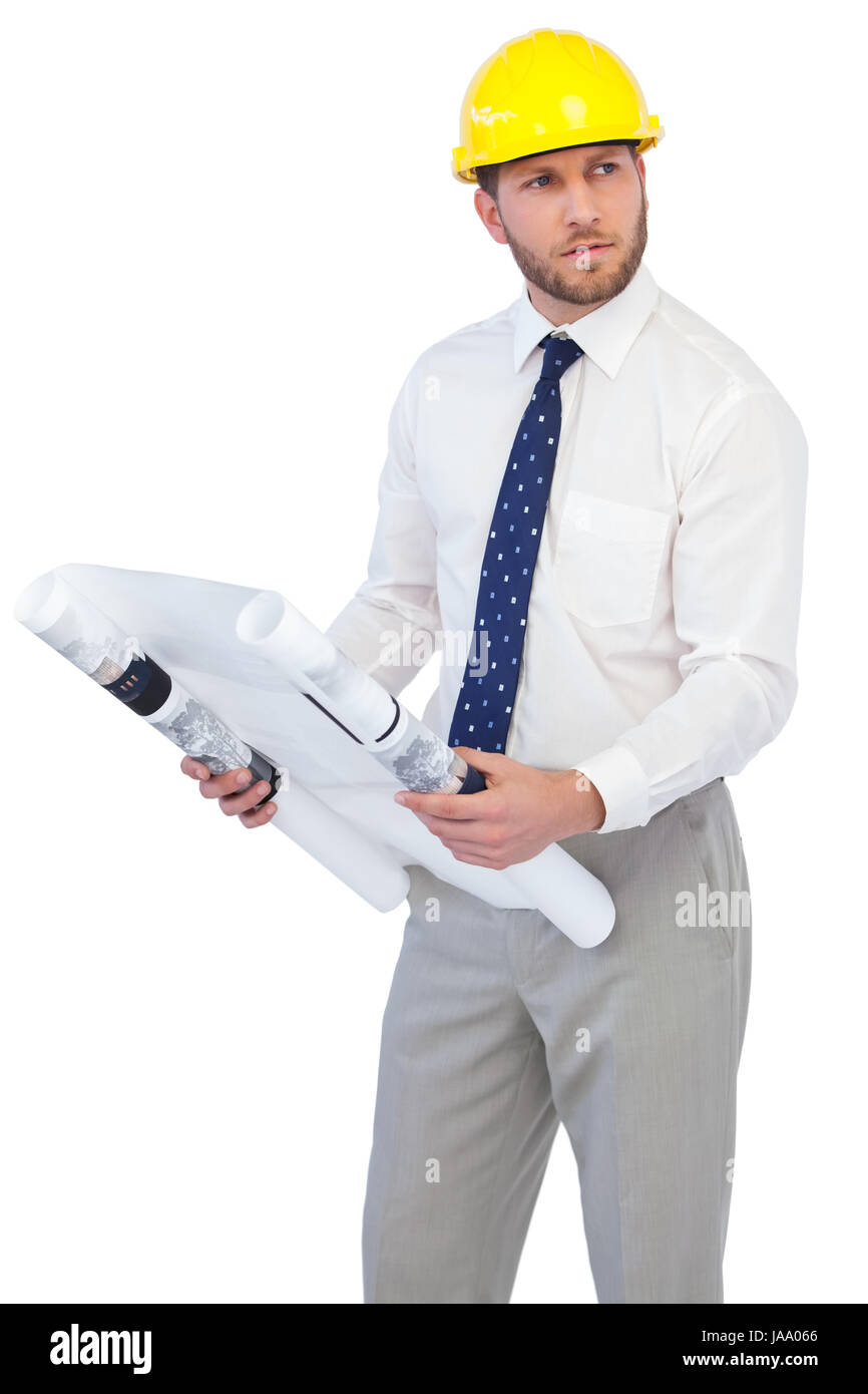 Pensive young architect posing against white background Stock Photo - Alamy