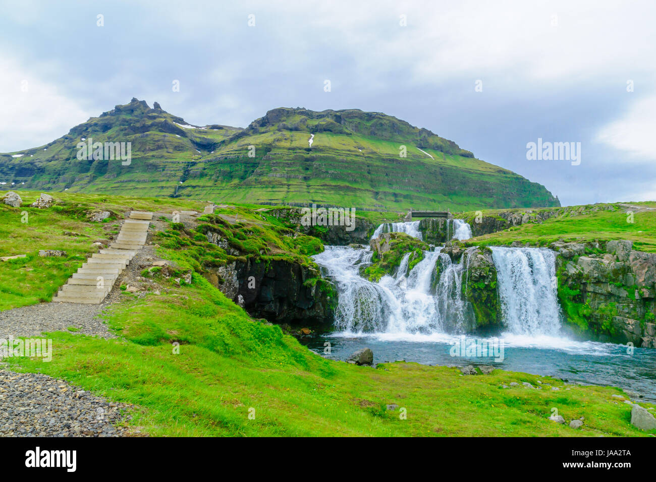 View of the Kirkjufellsfoss waterfalls, in the Snaefellsnes peninsula ...