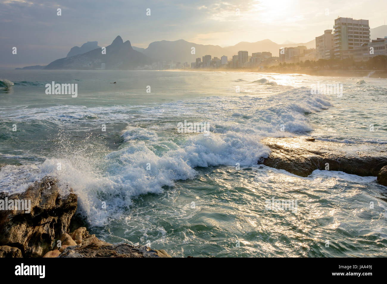 View of the beautiful sunset at Arpoador beach with Ipanema, Leblon and ...