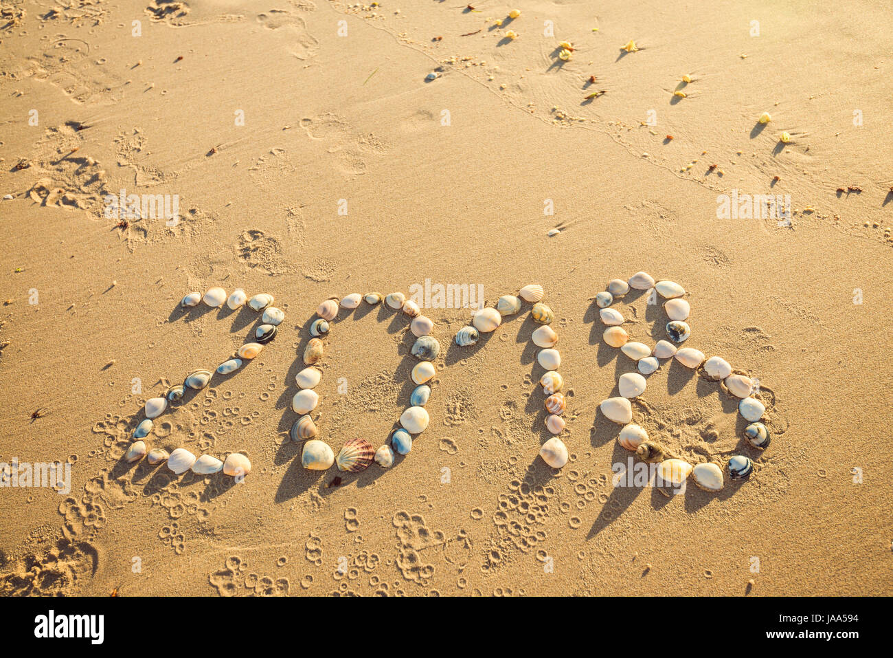 2018 New Year text made using shells on sand at Glenelg beach Stock ...