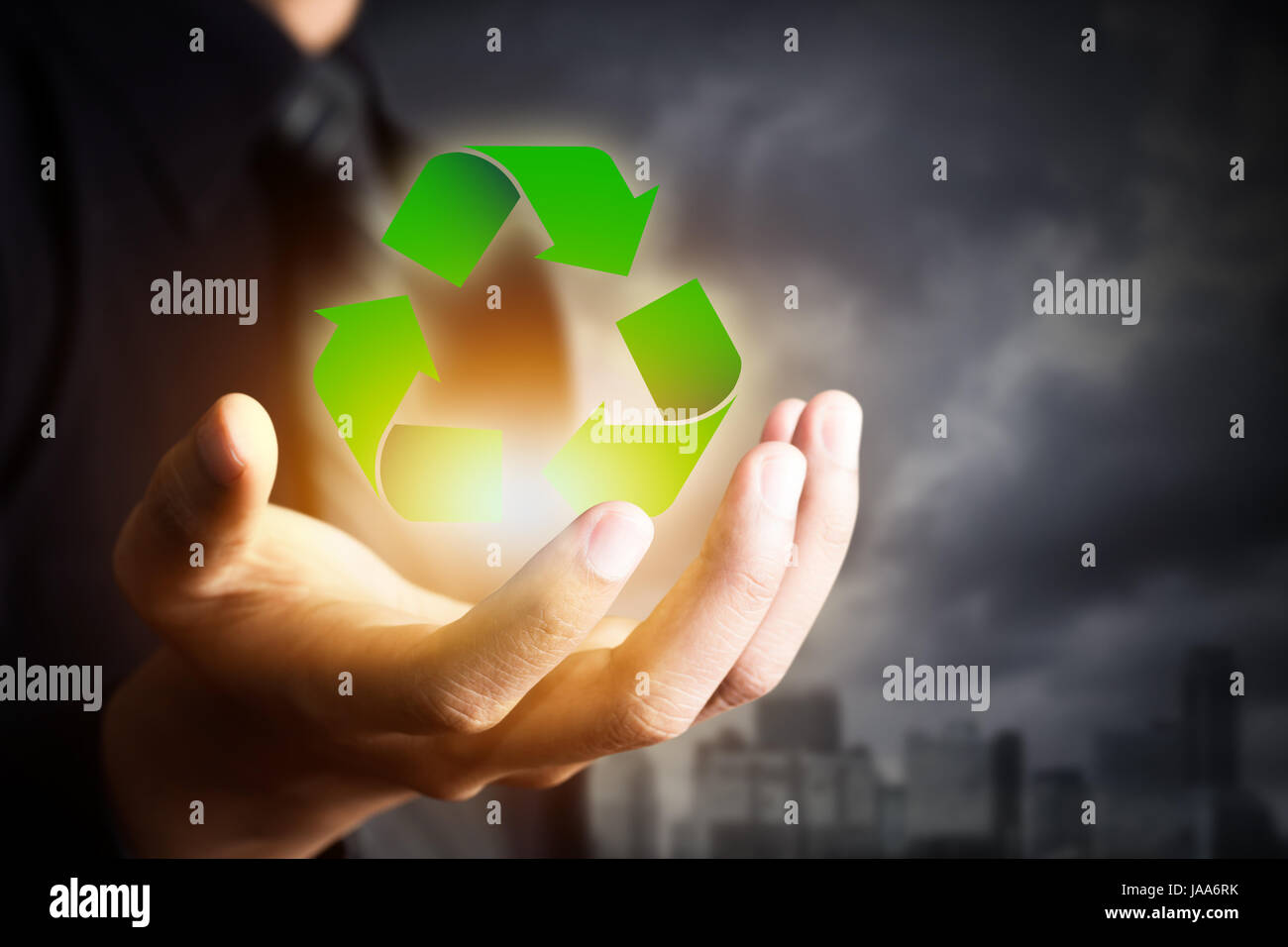 Business people holding recycle sign Stock Photo - Alamy