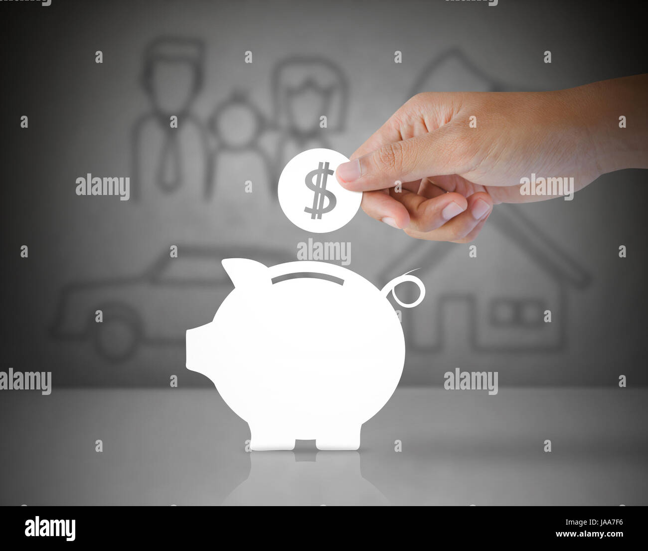 Male hand putting paper coin into a paper piggy bank with family ...