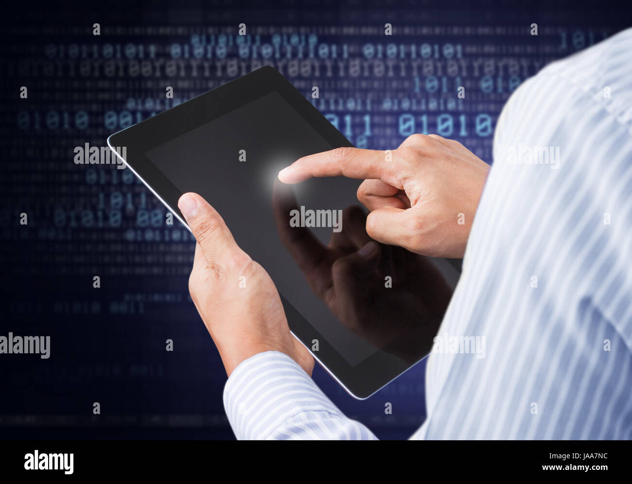 Businessman holding digital tablet on binary background Stock Photo - Alamy