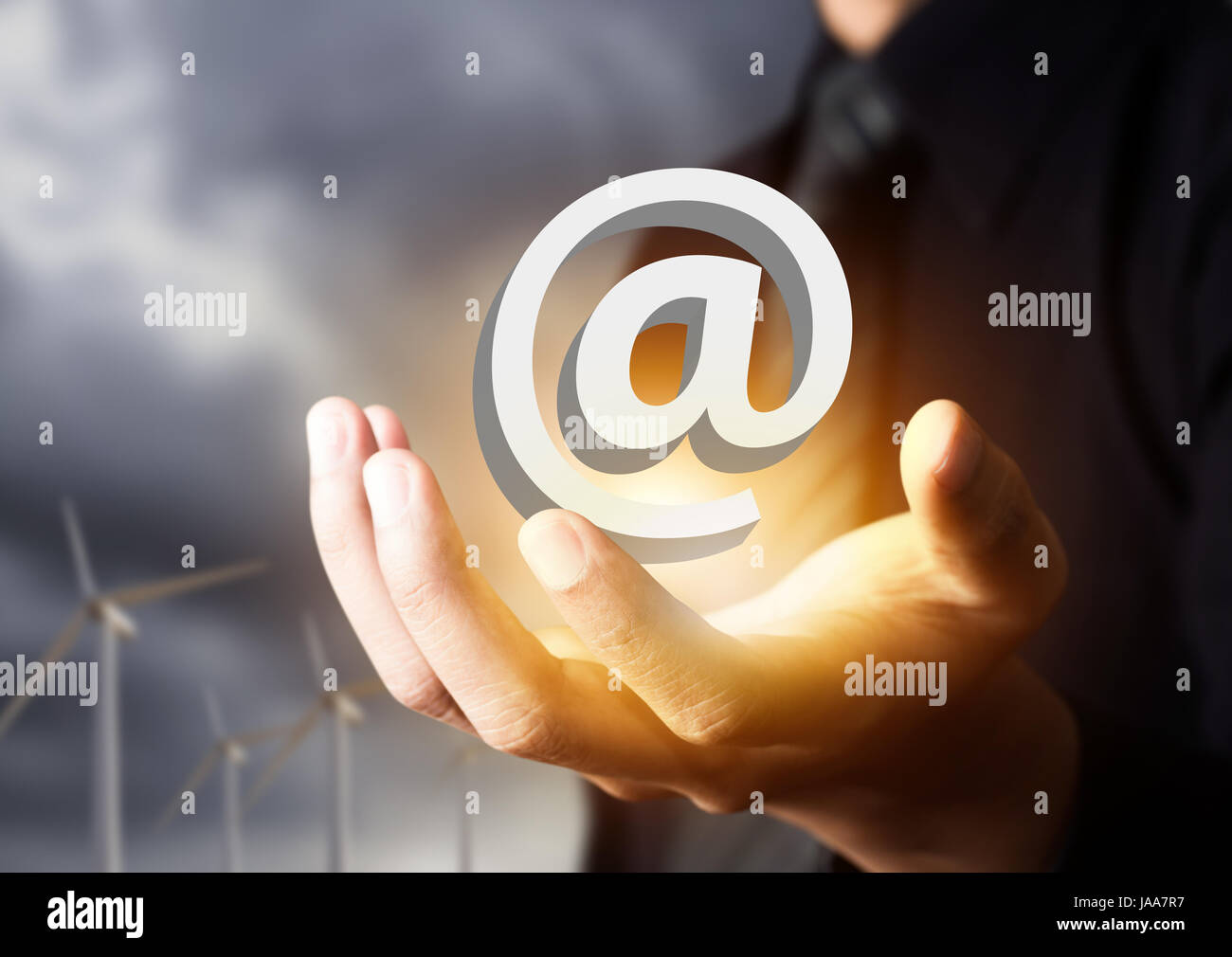 Email icon in businessman hand, contact us Stock Photo - Alamy