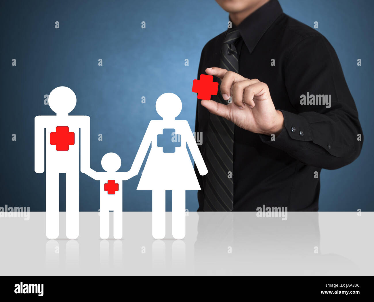 Happy family with red cross Stock Photo - Alamy