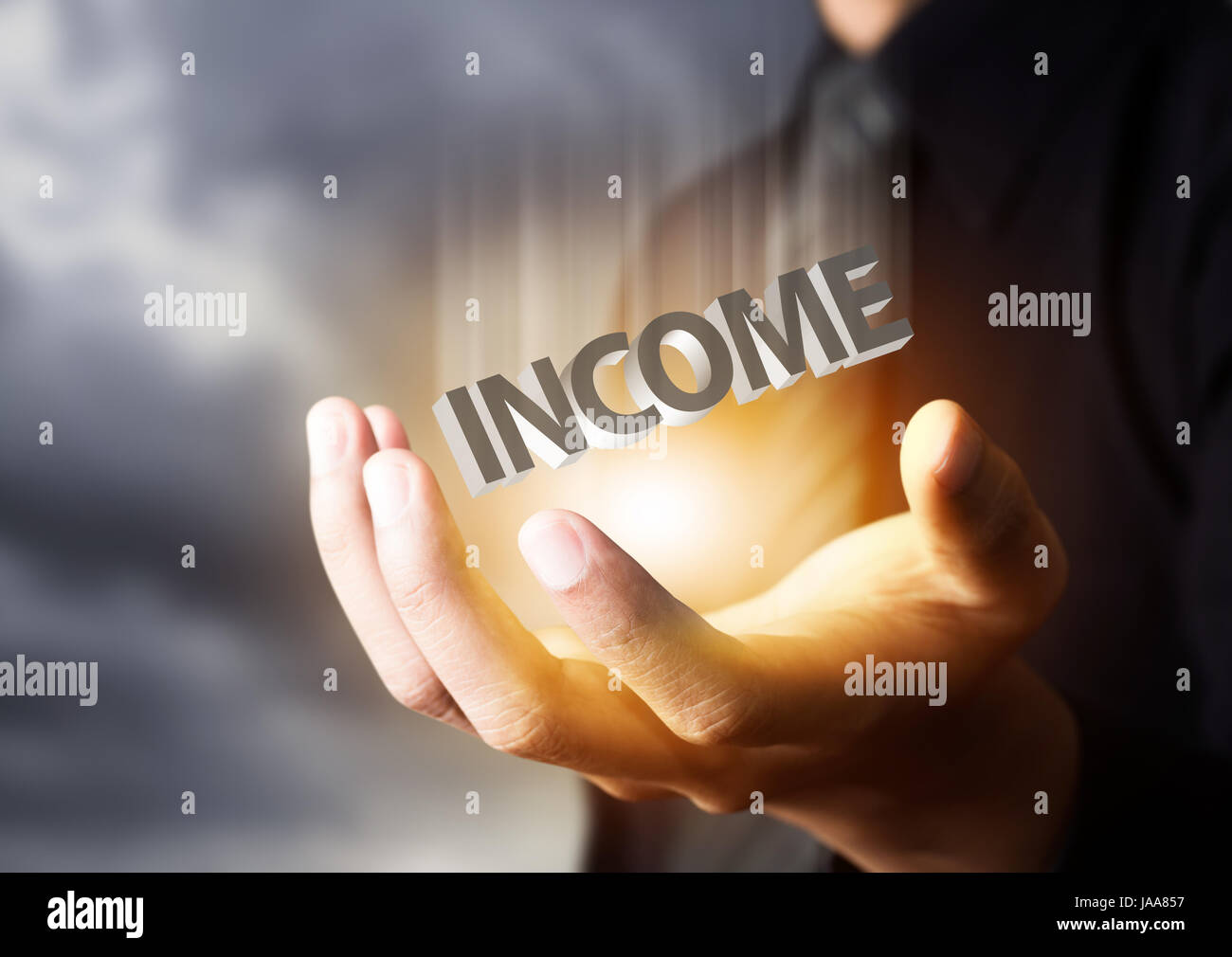 Businessman showing text income concept Stock Photo - Alamy