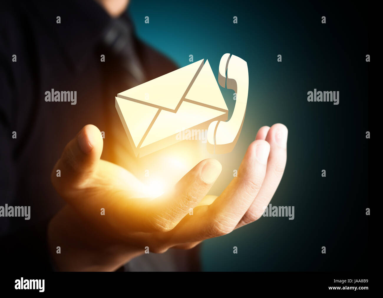 Contact us symbol in businessman hand, Email icon Stock Photo - Alamy