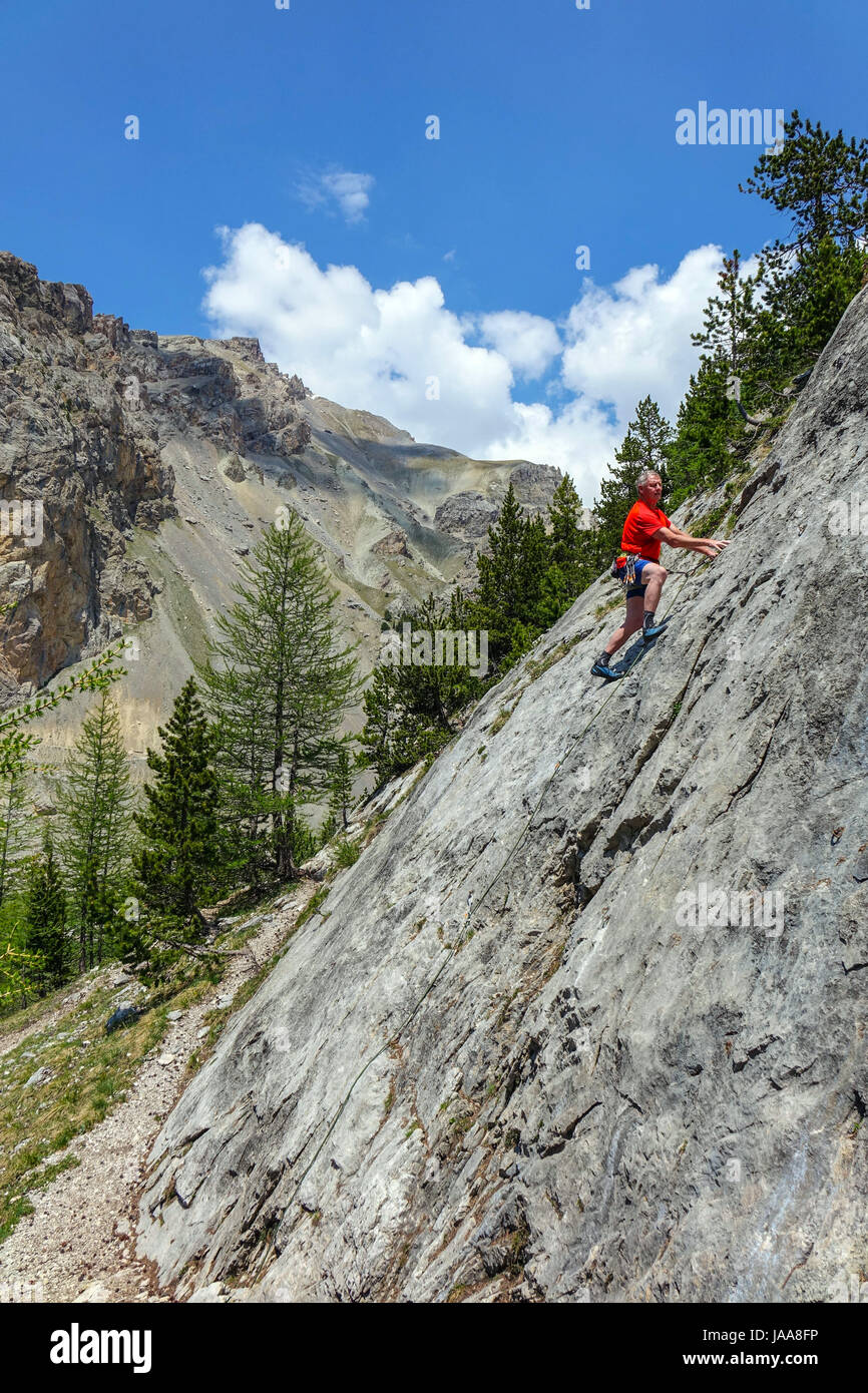 Mature male rock climbing, French Alps, France Stock Photo - Alamy