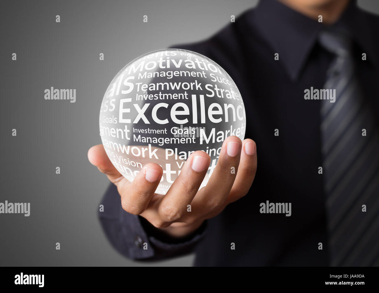 Businessman hand showing excellence word in crystal ball Stock Photo ...