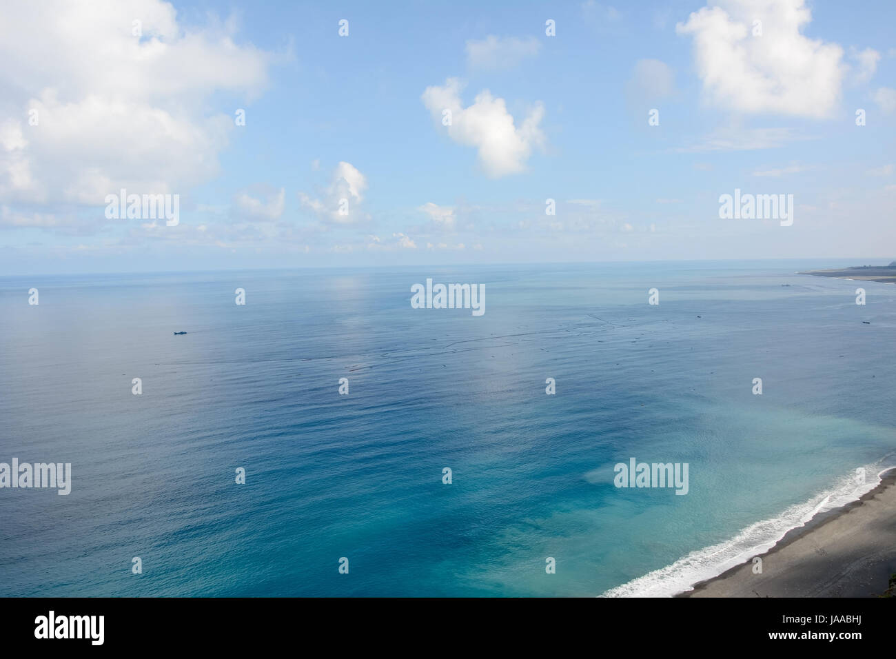 Beautiful seascape with ocean under blue sky Stock Photo - Alamy