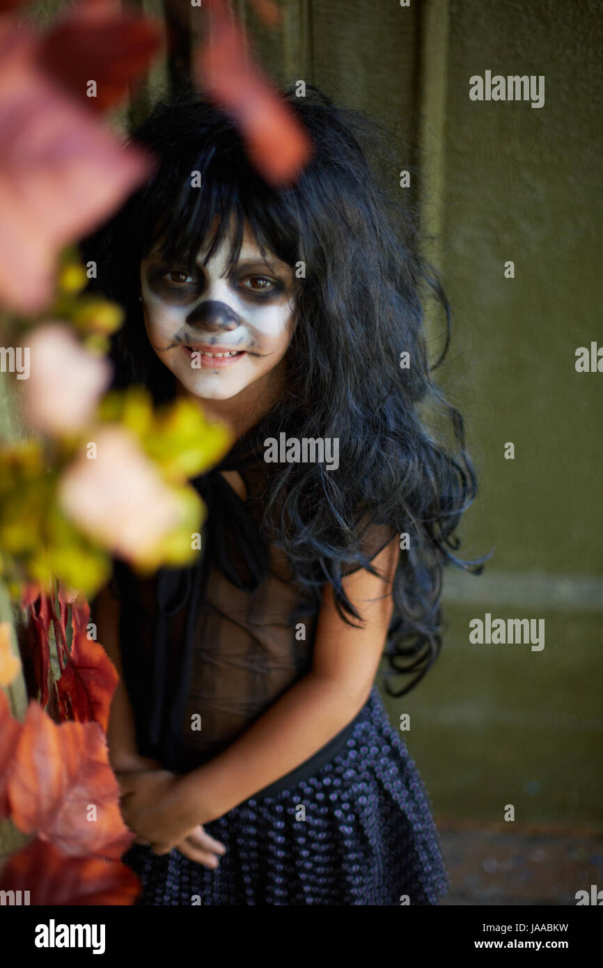 Portrait of spooky girl in Halloween attire looking at camera Stock ...
