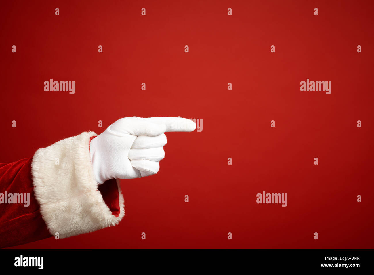 Photo of Santa Claus gloved hand in pointing gesture Stock Photo - Alamy