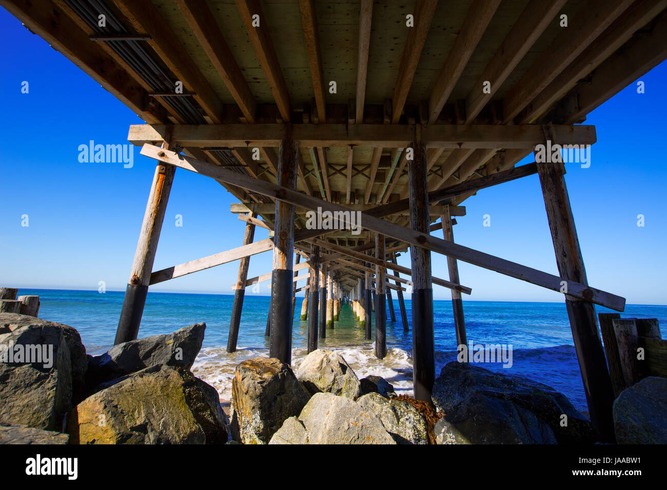 Newport pier beach in California USA seen from below Stock Photo - Alamy