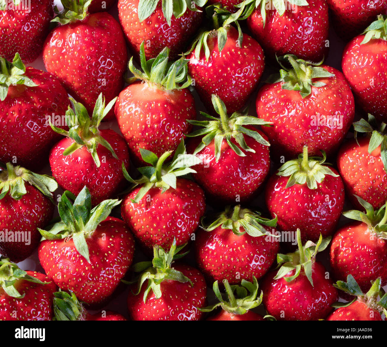 Berry background from a fresh strawberry texture closeup Stock Photo ...