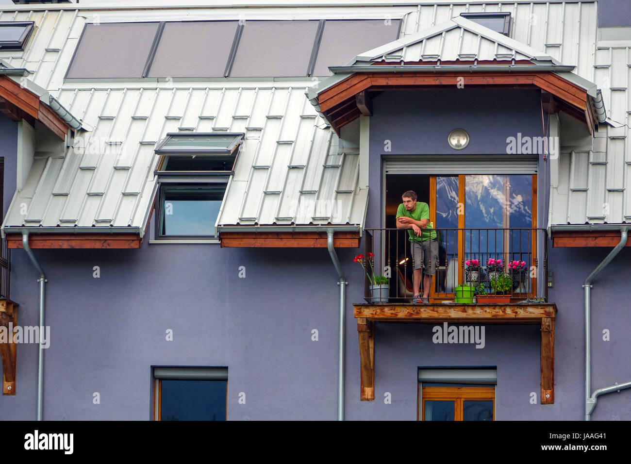 Man leaning on balcony railing hi-res stock photography and images - Alamy