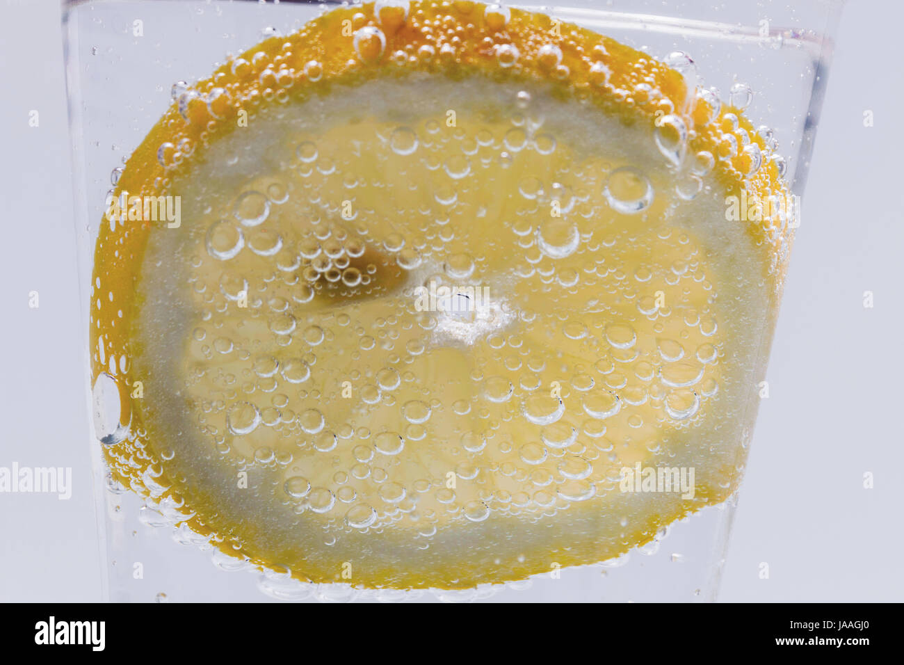 Lemon Slice In Water With Air Bubbles Stock Photo - Alamy
