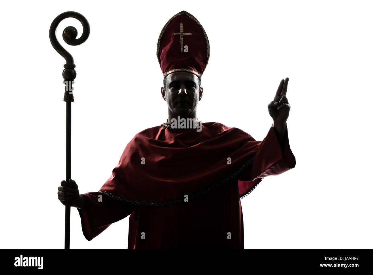one man cardinal bishop silhouette saluting blessing in studio isolated ...