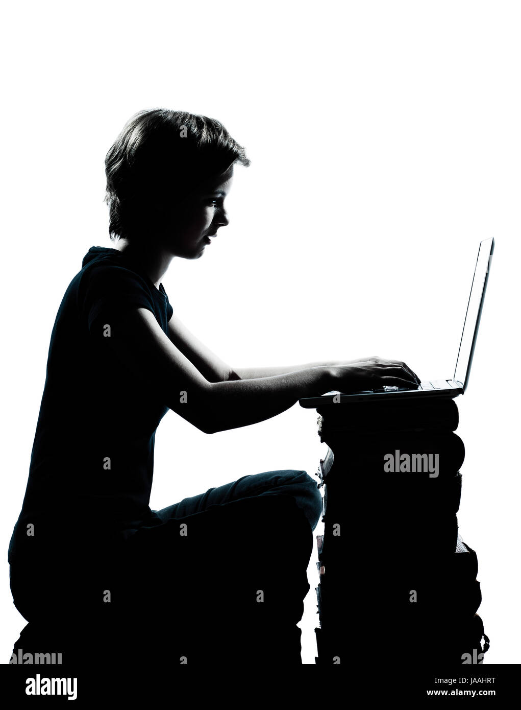 one caucasian young teenager silhouette boy or girl sitting computer ...