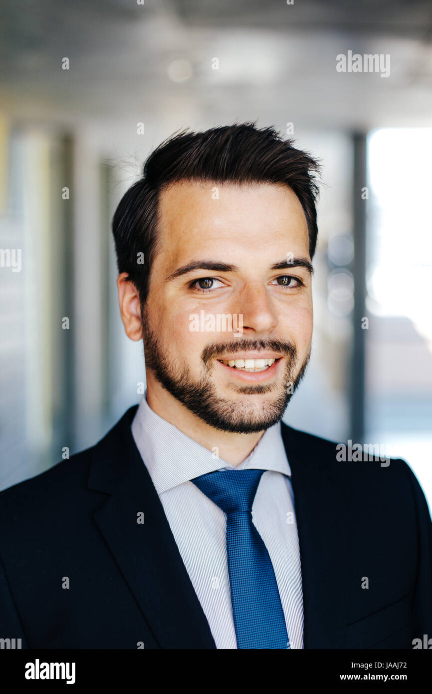 Businessman with suit smiling Stock Photo - Alamy