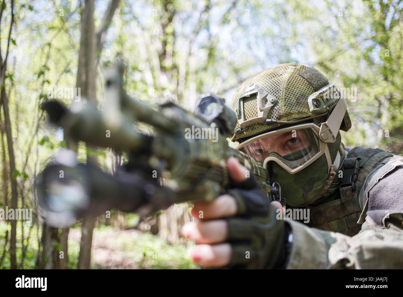 Portrait of soldier with gun Stock Photo - Alamy
