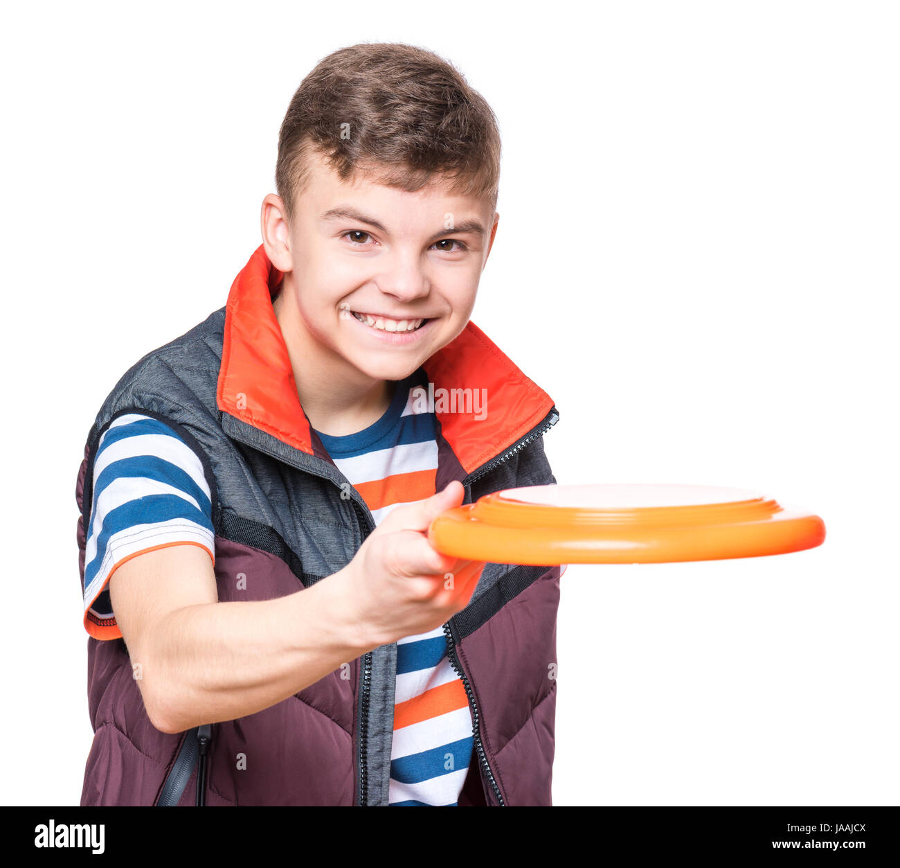 Teen boy with flying disk Stock Photo - Alamy