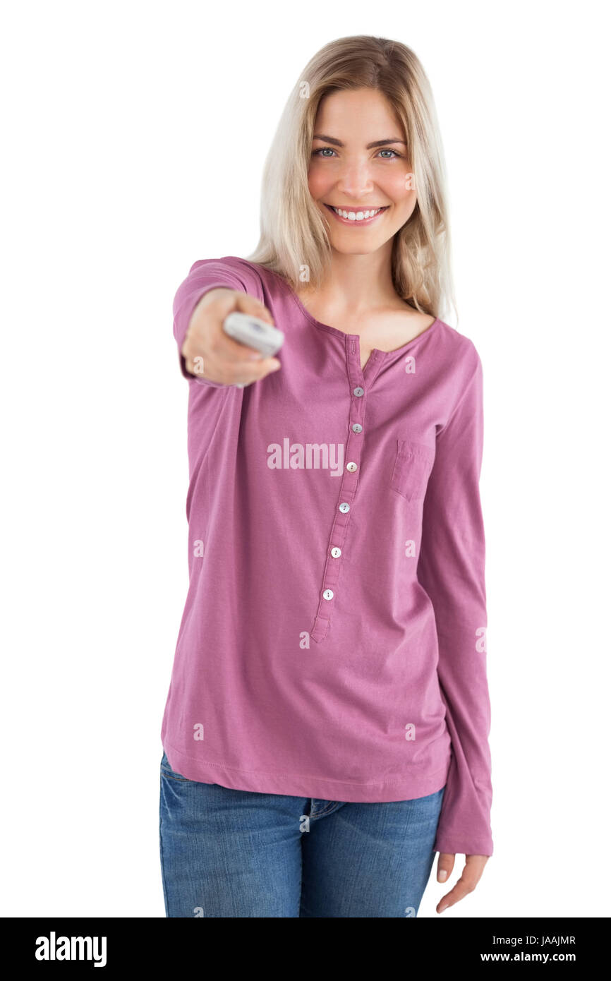 Smiling woman holding remote control on a white background Stock Photo ...
