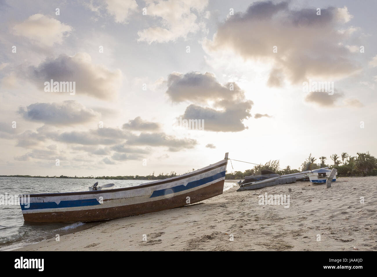 Sunset on tropical island of angola mussulo with boats Stock Photo - Alamy