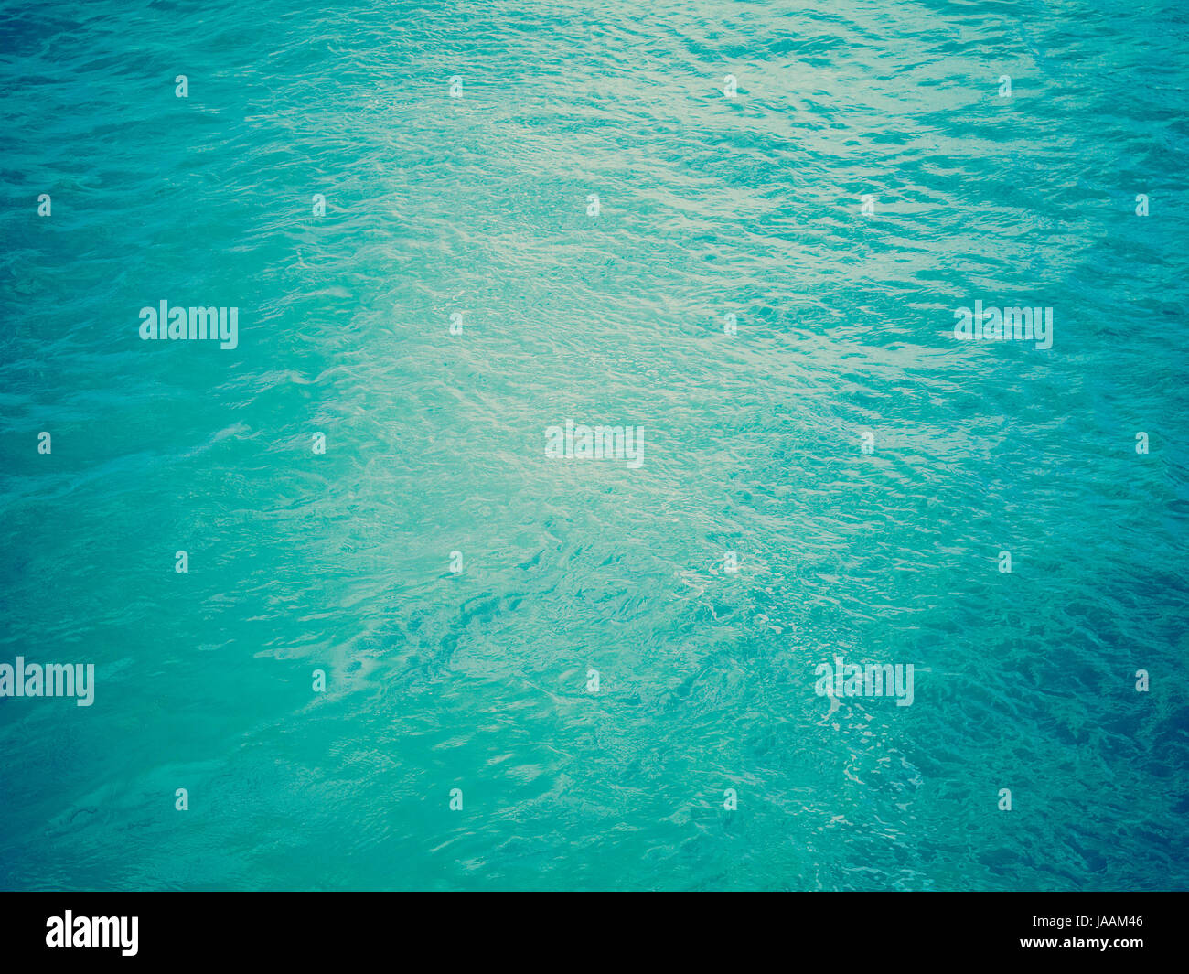 Vintage looking grunge blue green water reflections useful as a ...