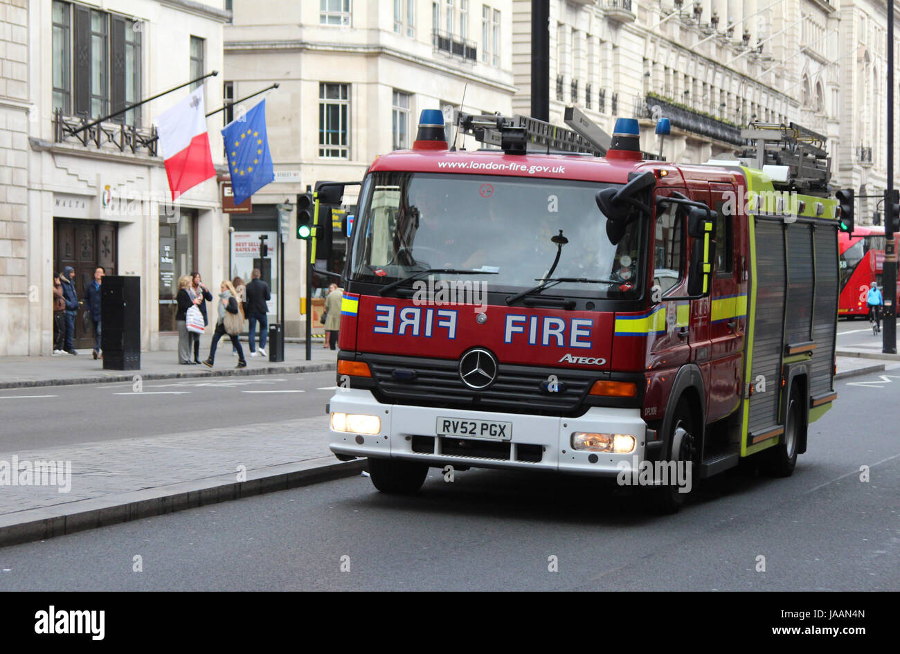 A London Fire Brigade emergency vehicle moving along Piccadilly ...