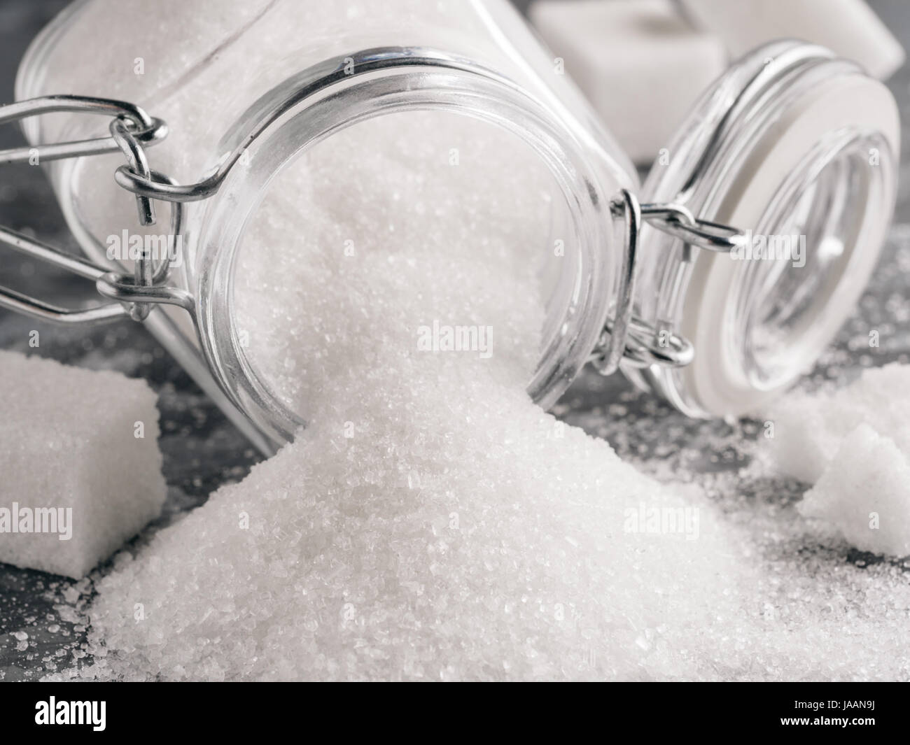 Close up view of white sugar on gray galvanized iron background ...