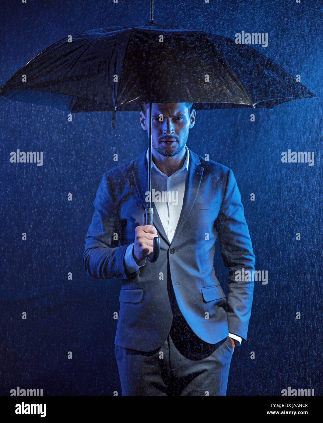 Portrait of a handsome guy under the thunderstorm Stock Photo - Alamy