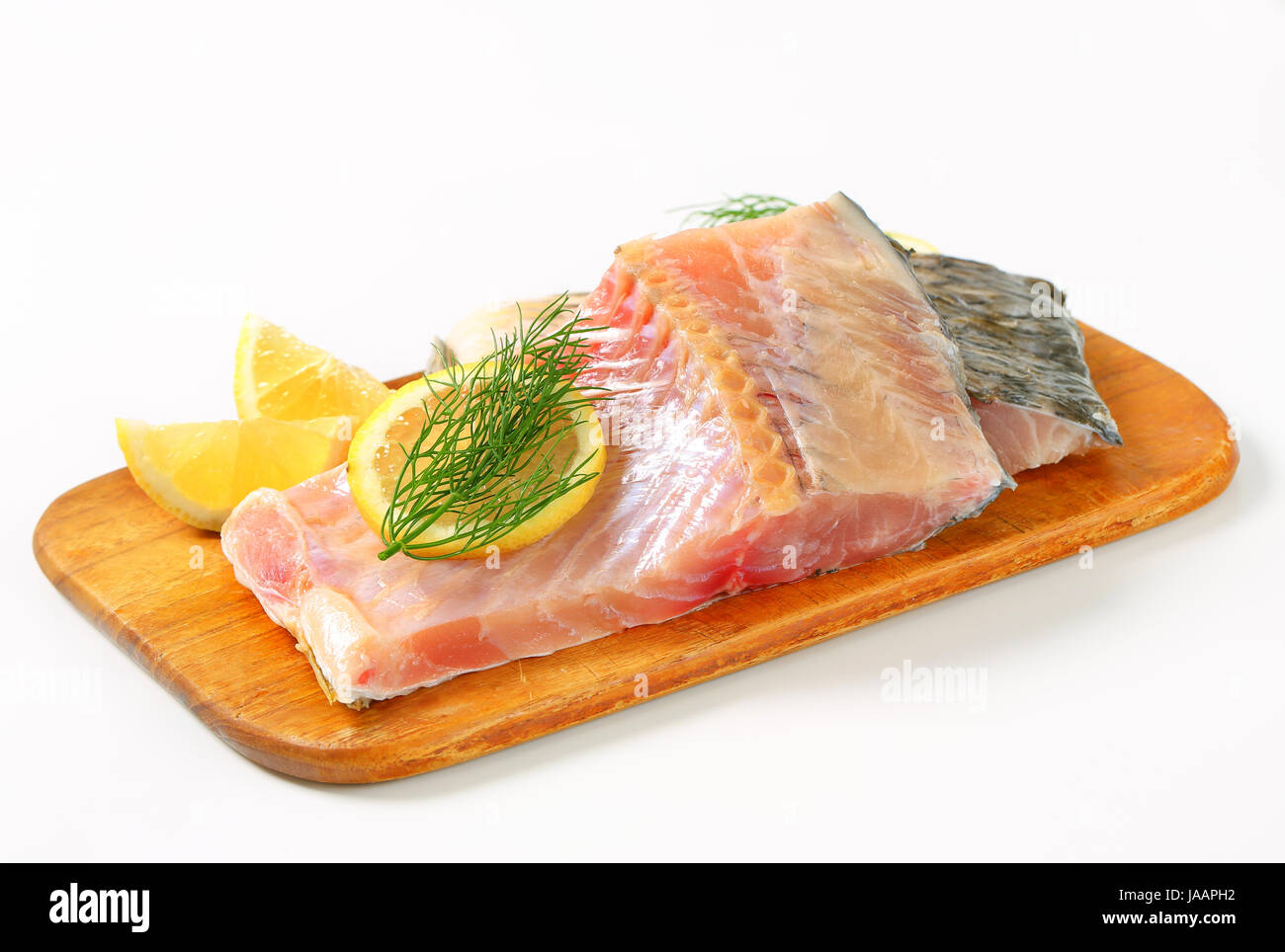 Raw carp fillets on cutting board Stock Photo - Alamy