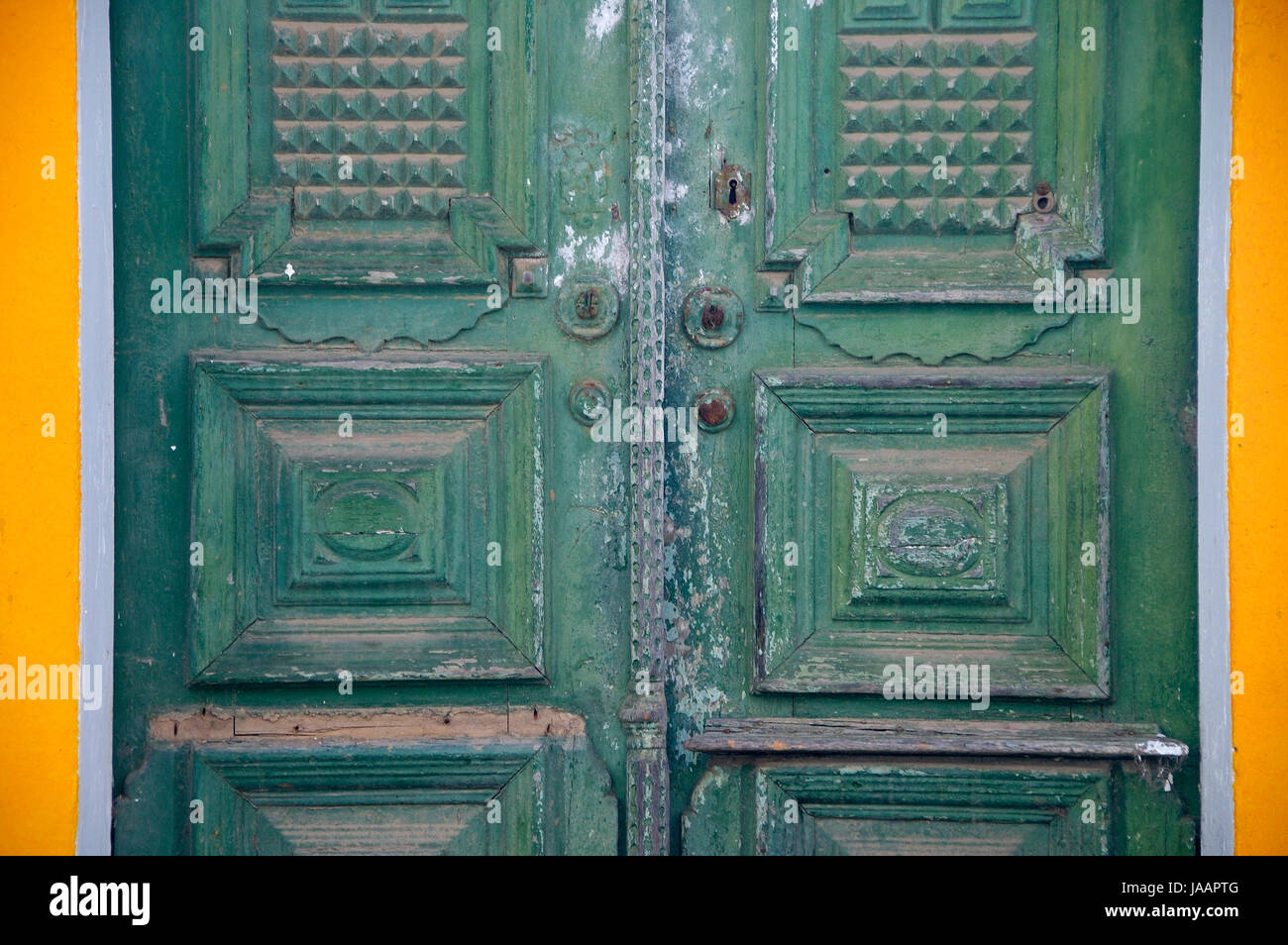 Slightly weathered green double doors in Atalaia Stock Photo - Alamy