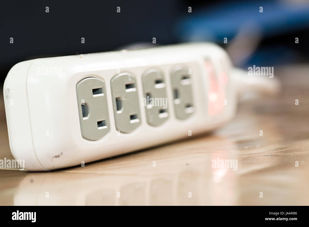 White power strip or extension block laying on the floor Stock Photo ...