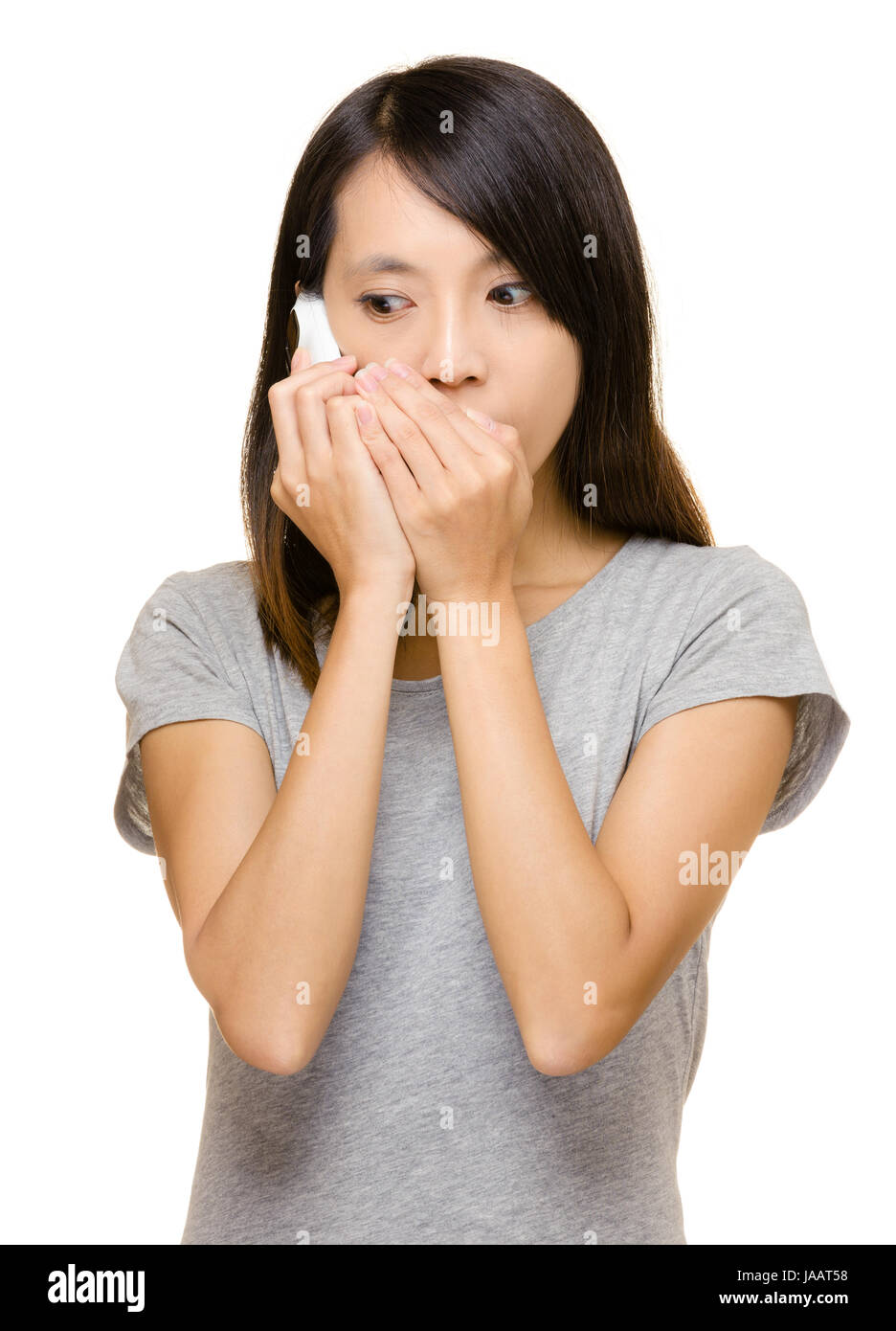 Asian woman talking phone secretly Stock Photo - Alamy