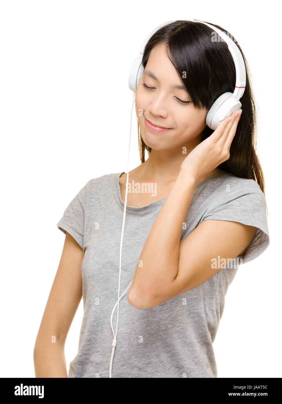 Asian woman enjoy the music Stock Photo - Alamy
