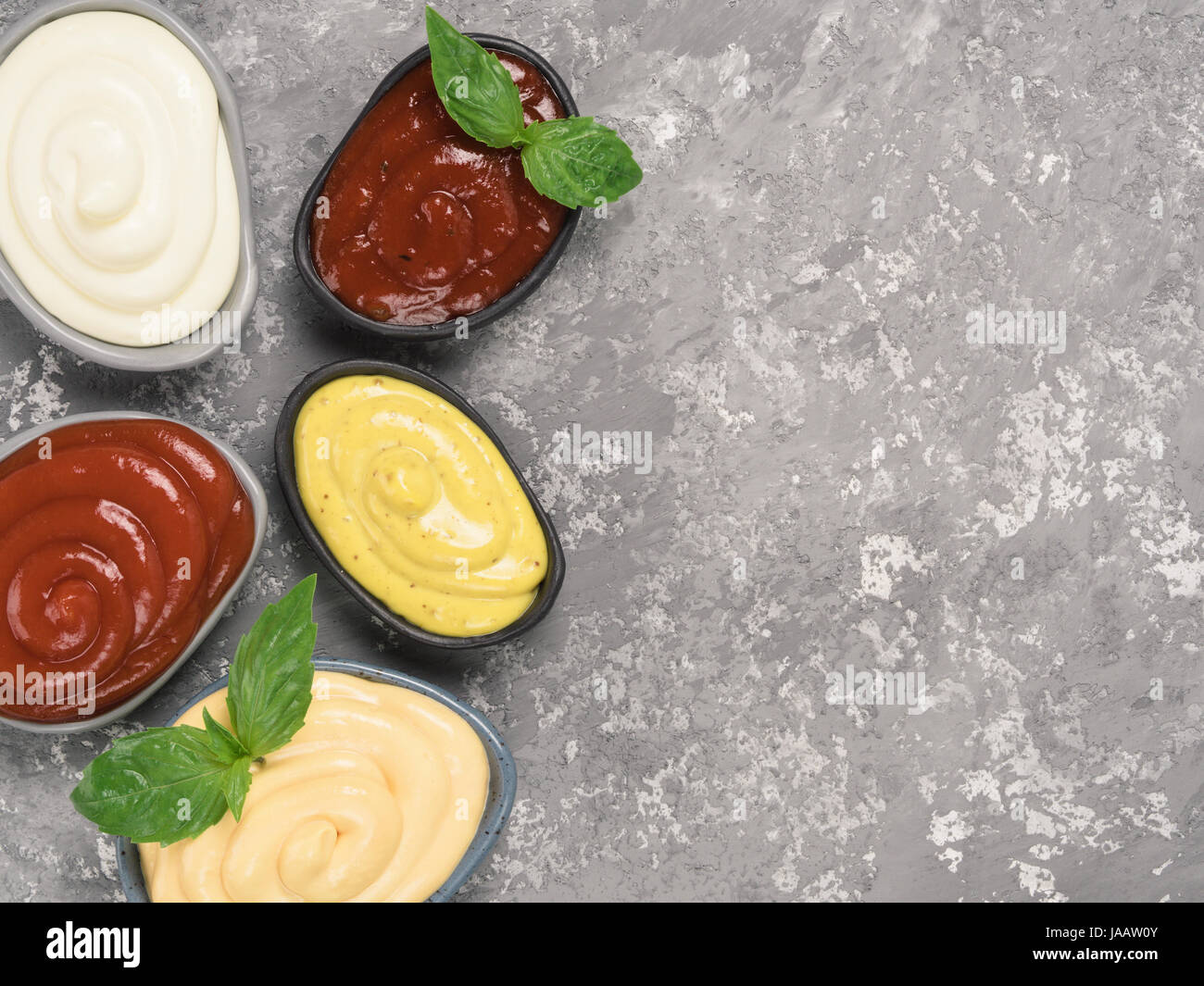 classic sauces set on gray background Stock Photo - Alamy