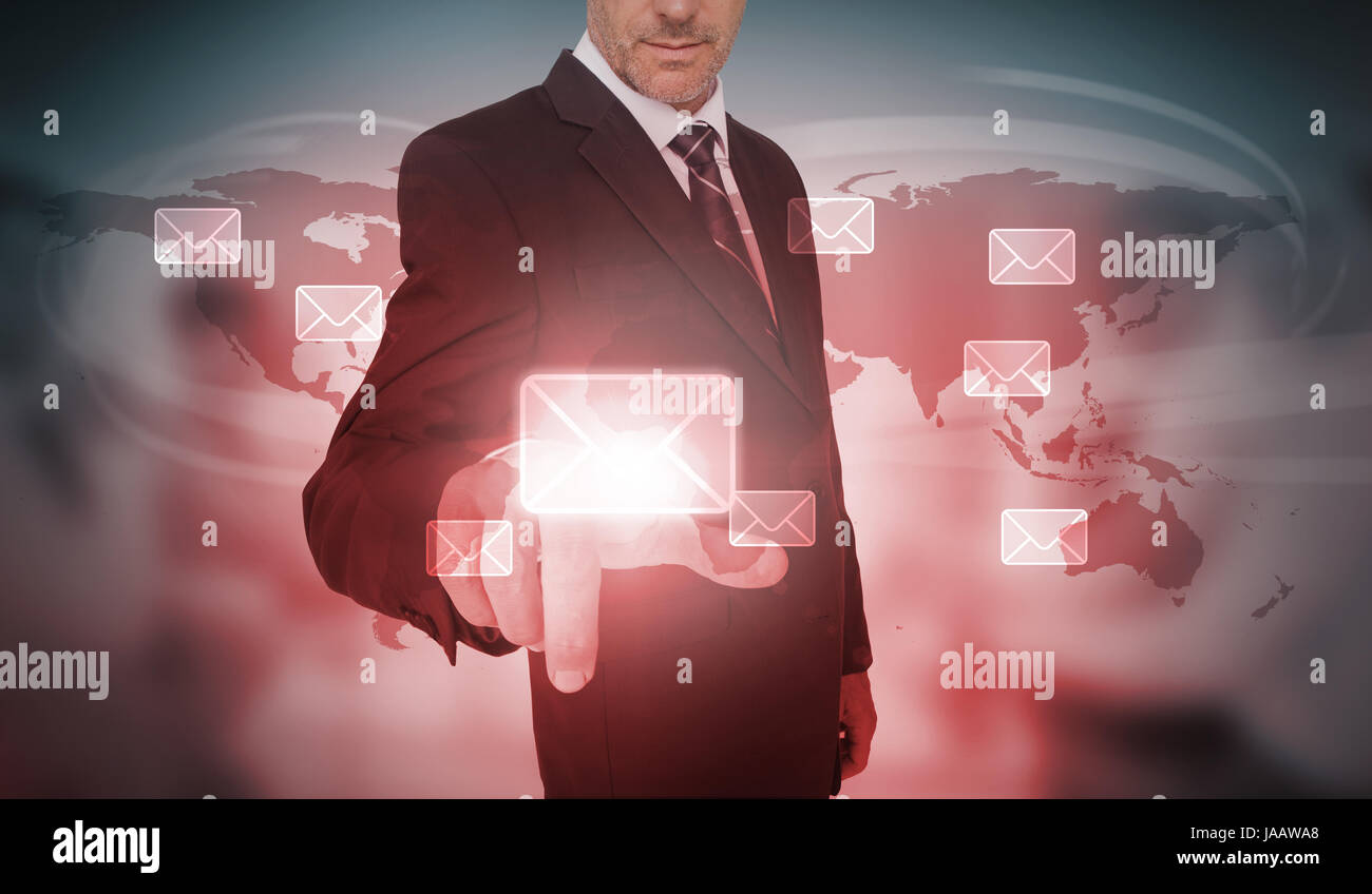 Businessman selecting futuristic email interface on world map ...