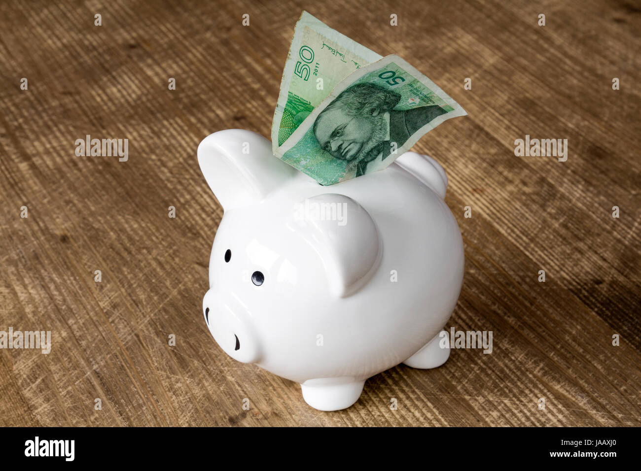 White piggy bank with 50 Norwegian Kroner (NOK Stock Photo - Alamy