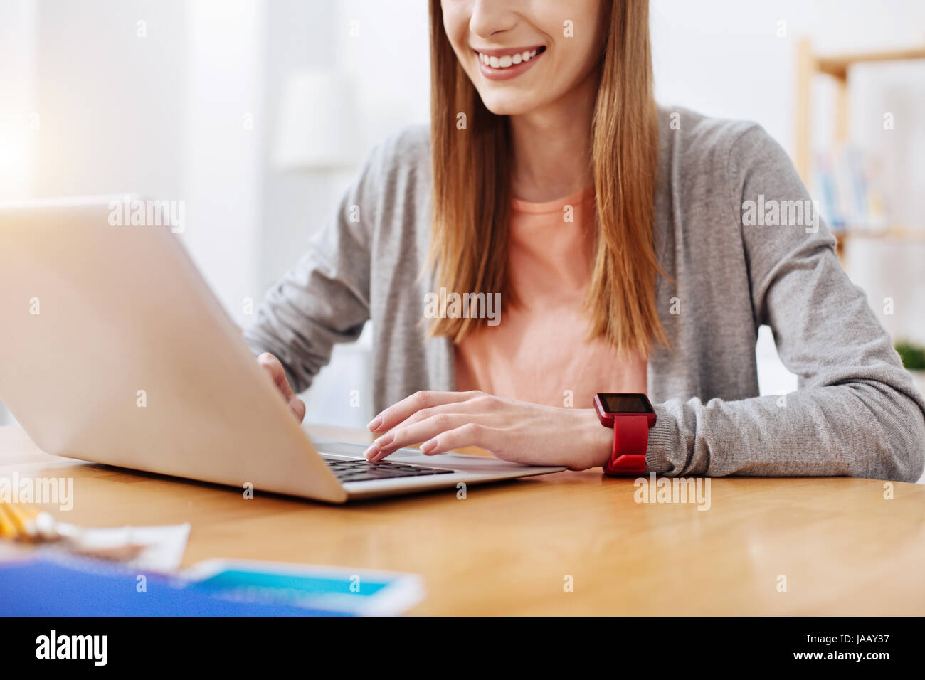 Modern student. Bright clever persistent lady using her computer for ...