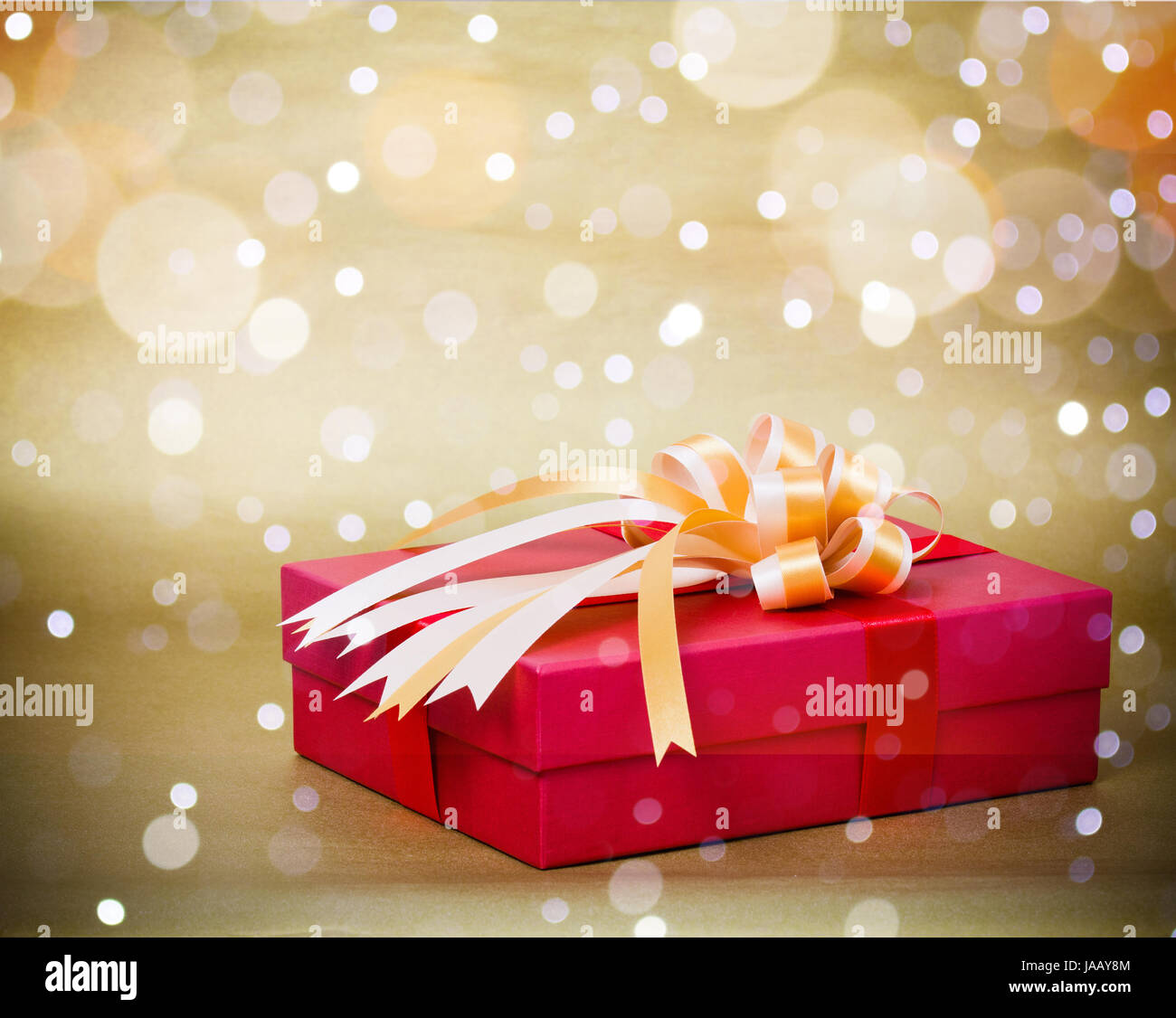 Red Gift box with gold ribbon Stock Photo - Alamy