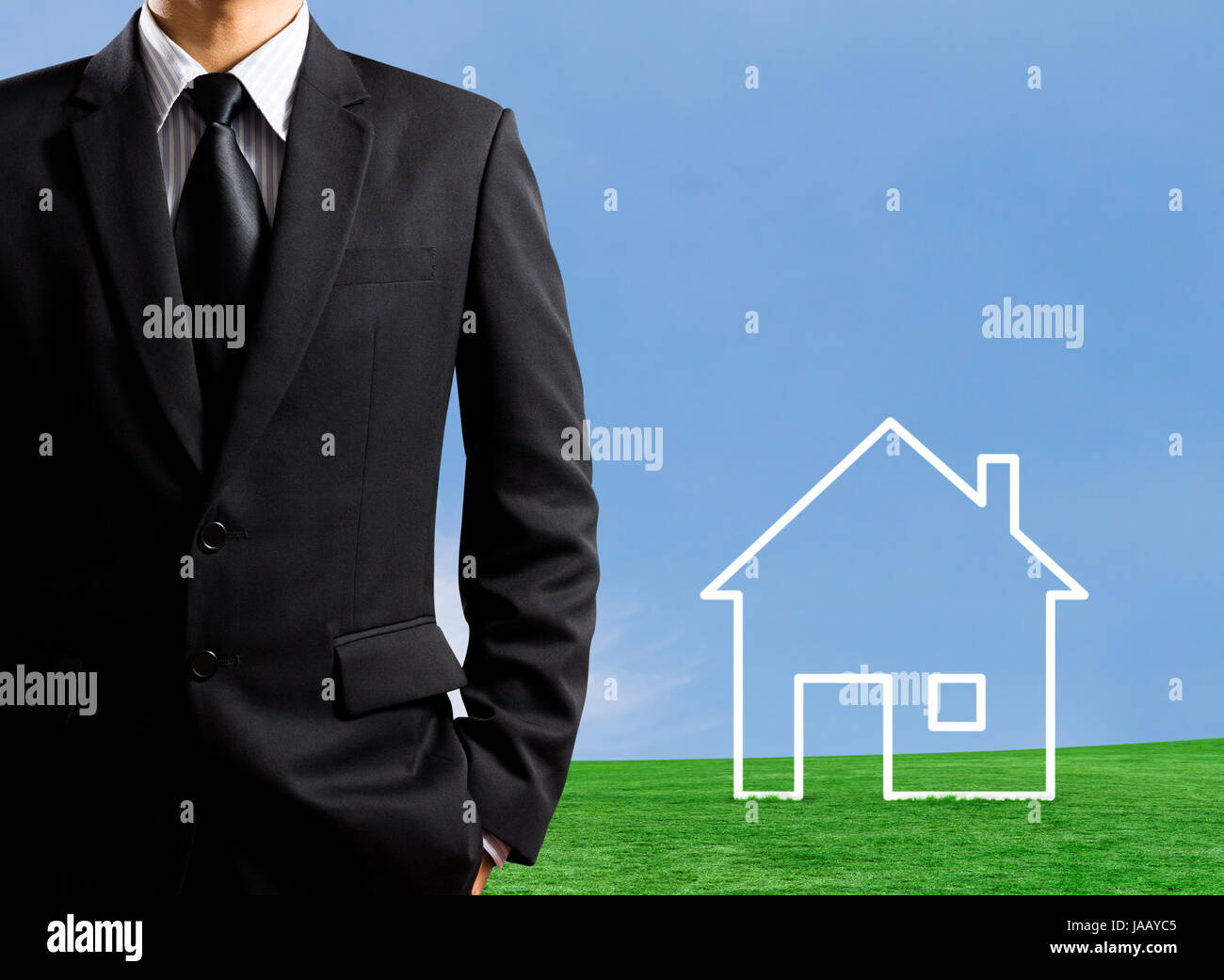 Man drawing a house in a field Stock Photo - Alamy