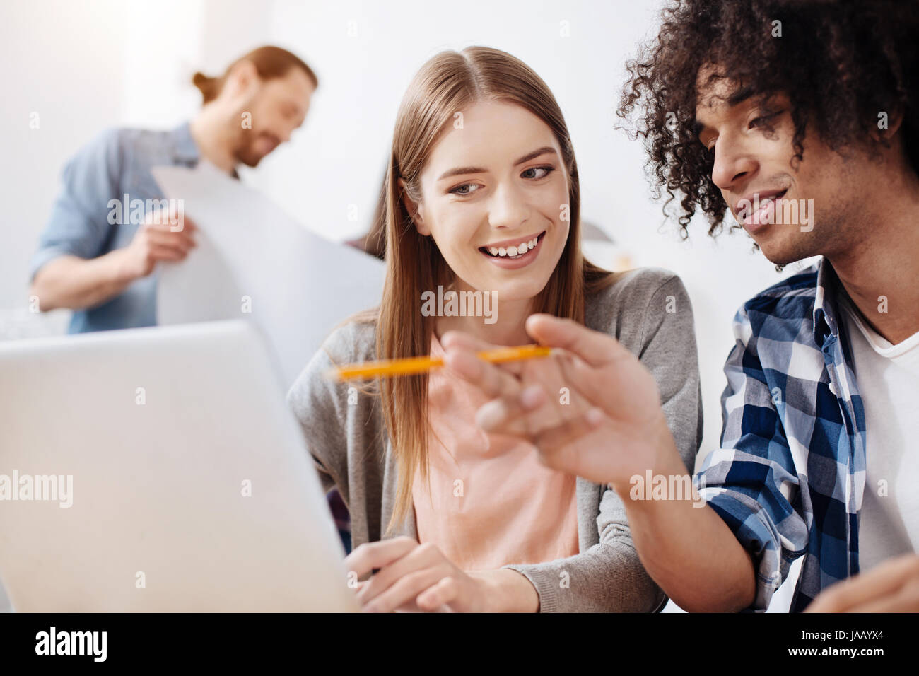 Add more details here. Young talented intelligent guy giving his friend ...