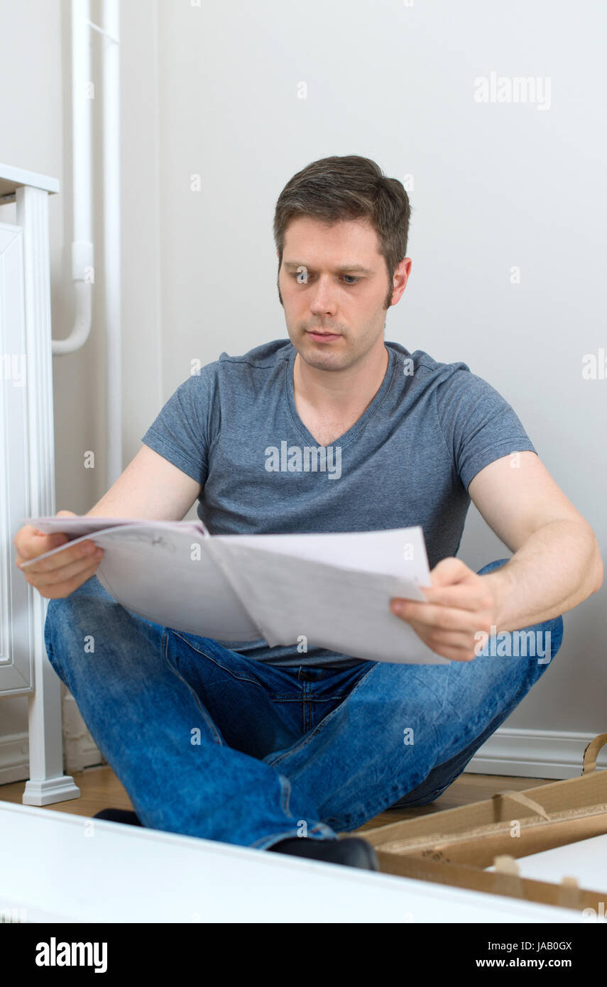 Person reading instruction manual hi-res stock photography and images ...