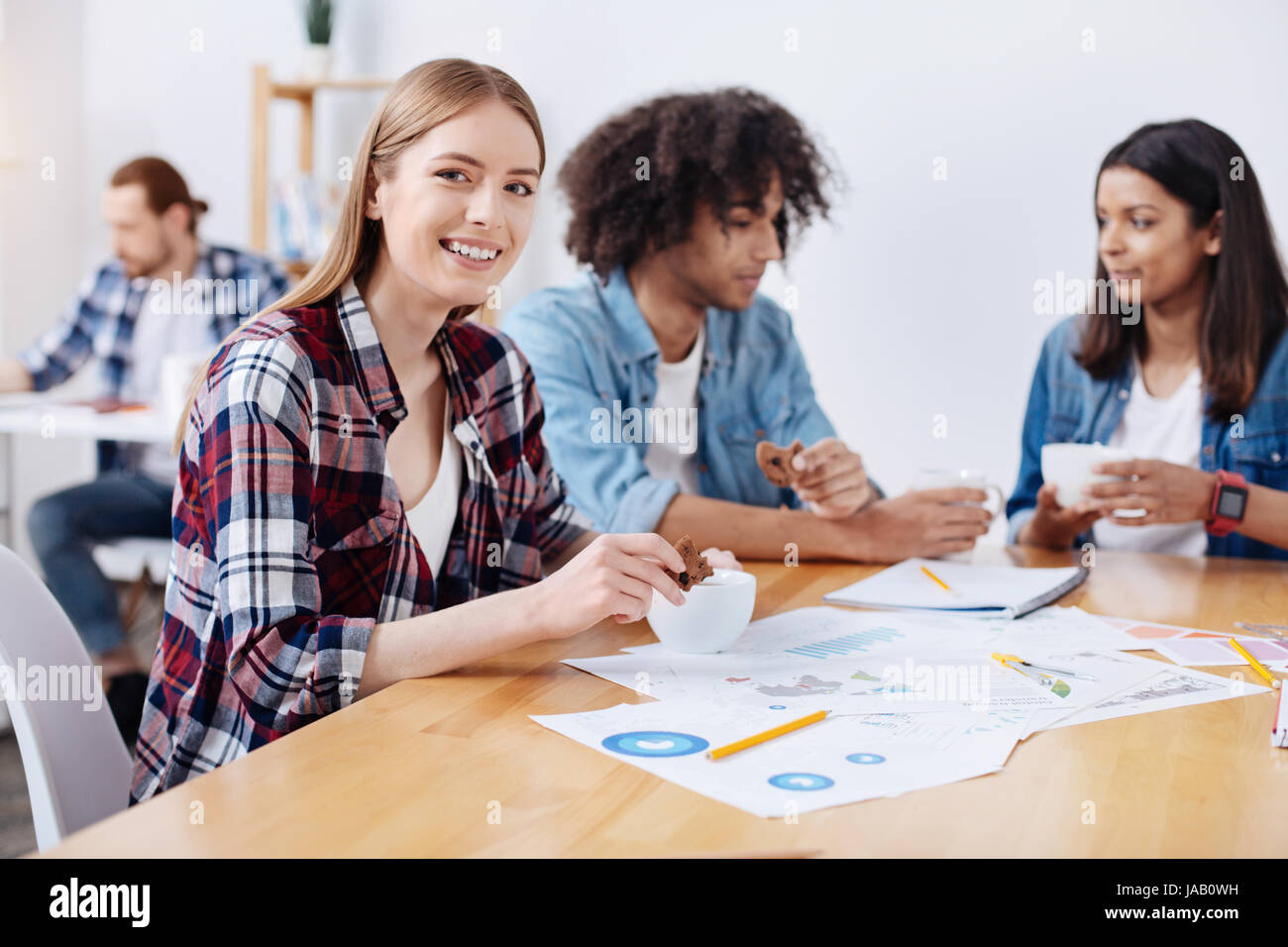 Charging with positivity. Positive motivated enthusiastic people eating ...