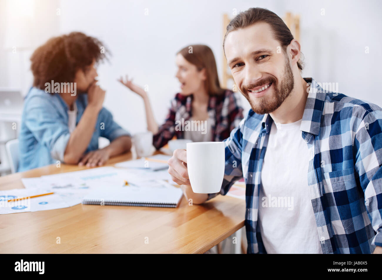 Great people, great company. Nice relaxed sociable man sitting at the ...