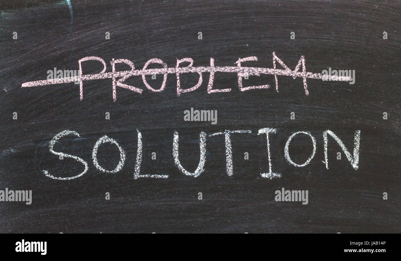 Problems Solutions handwritten with white chalk on a blackboard Stock Photo - Alamy