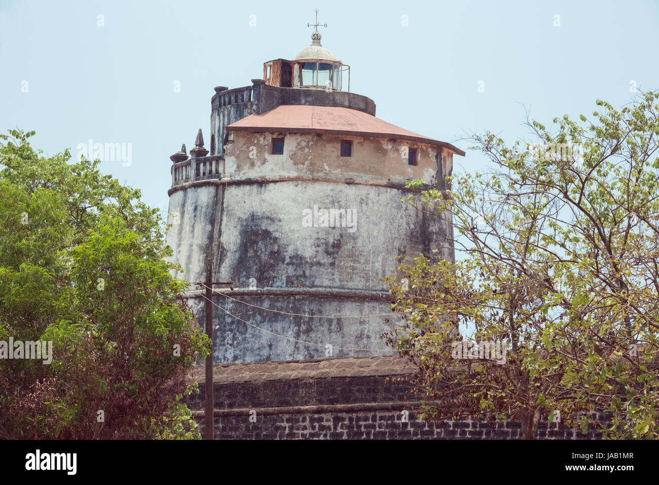 The lighthouse in Fort Aguada on the west coast of India emerging from ...